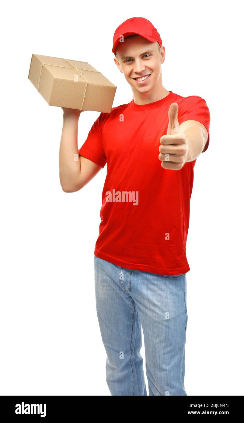 Young handsome delivery man with a carton package, isolated on white ...