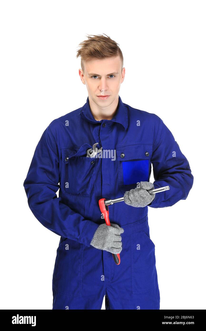 A young repairman holding car repairing tool, on white background Stock ...