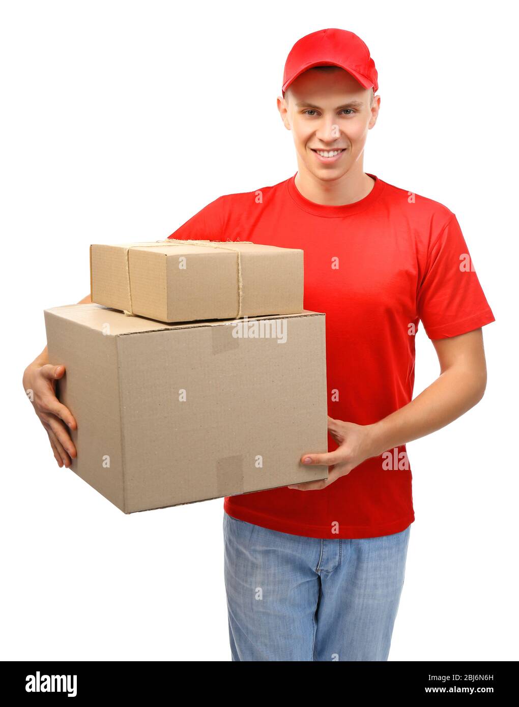 Young handsome delivery man with carton boxes, isolated on white Stock ...