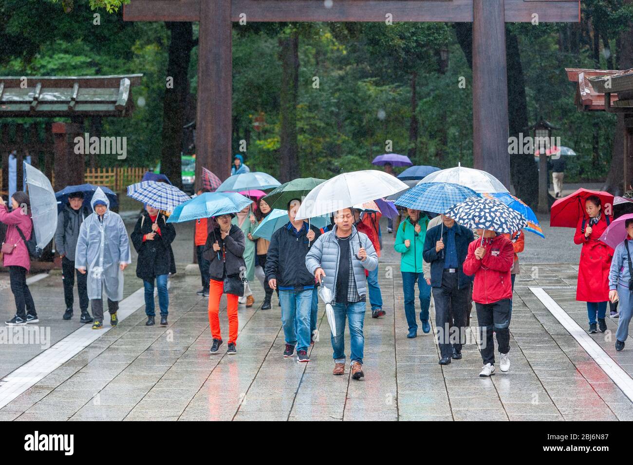 Japanese families, tourists and travelers walking in the rain to Meiji ...