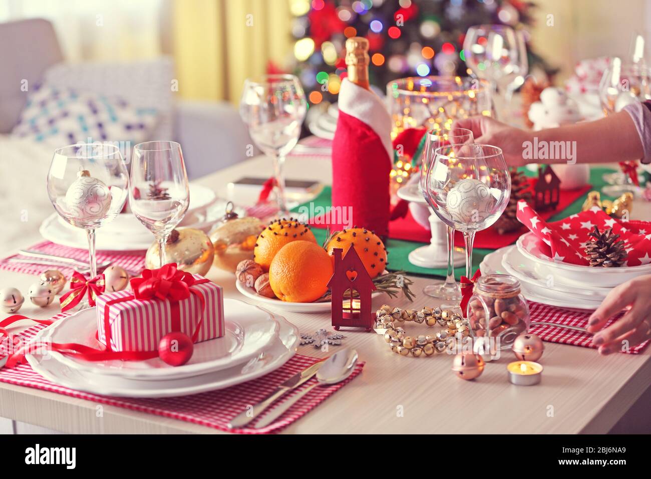 Hand lights candle on table hi-res stock photography and images - Alamy