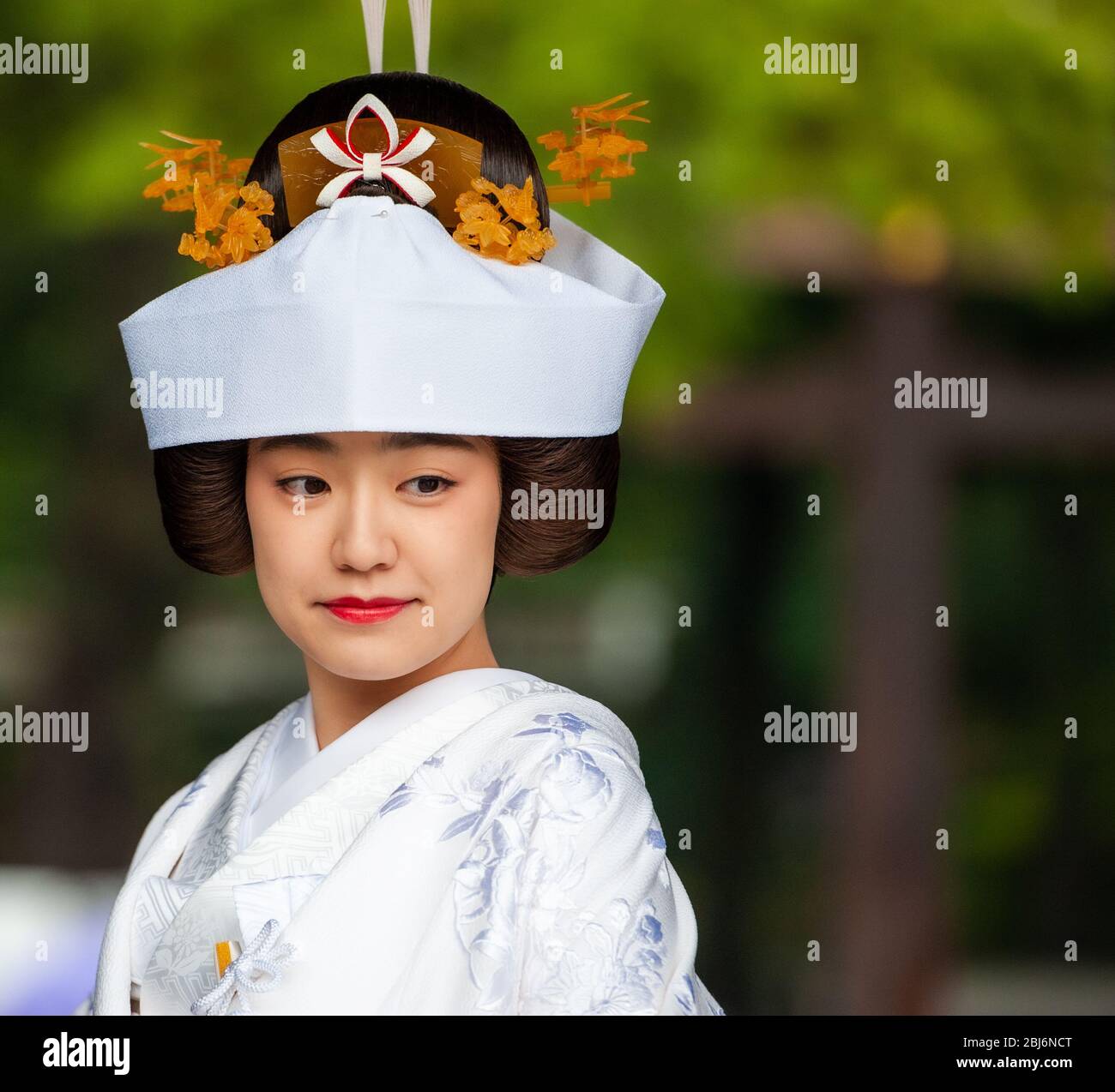 Japanese bride wearing traditional kimono and headdress just before the ...