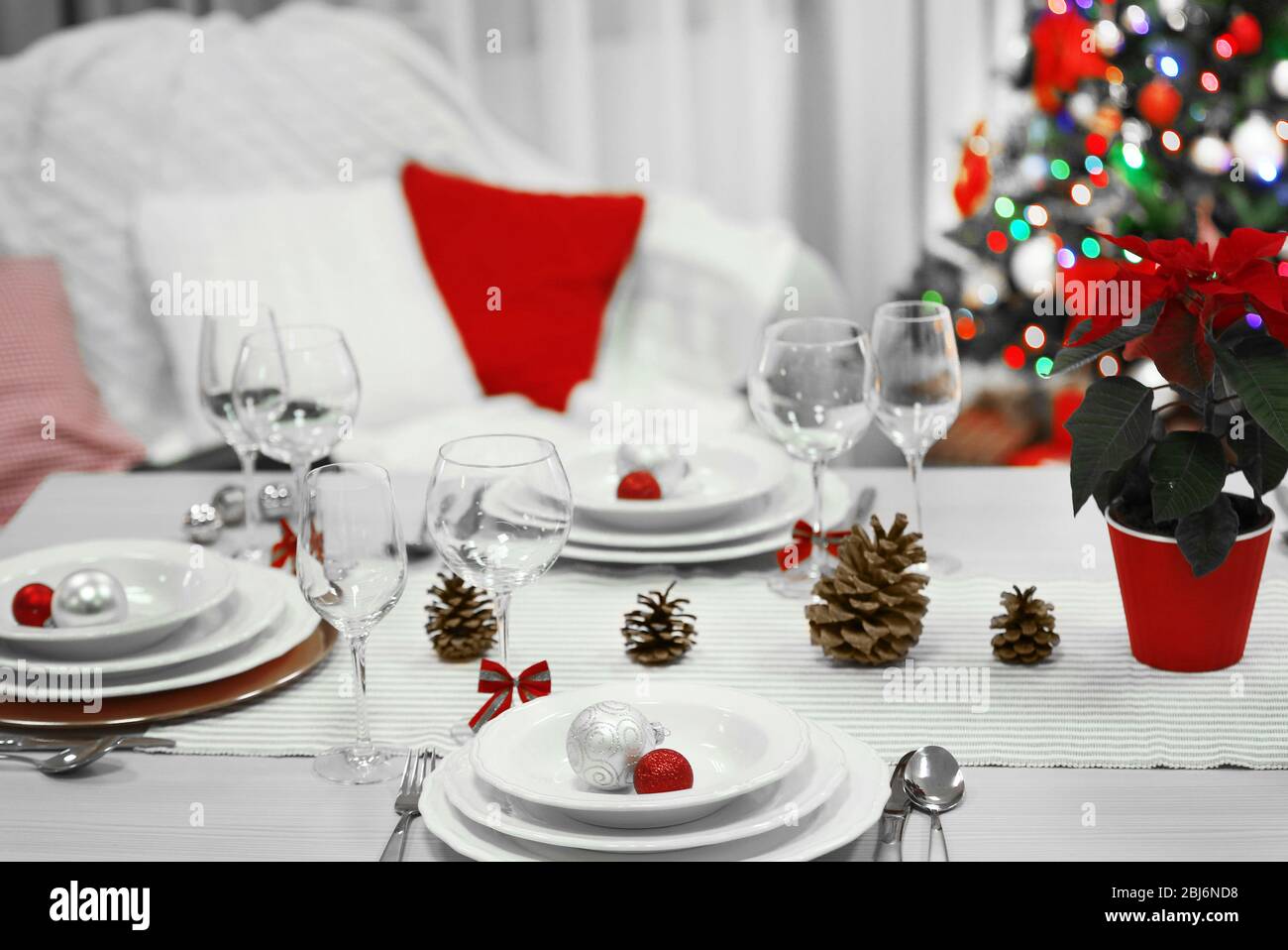 Christmas table setting with holiday decorations background Stock Photo ...