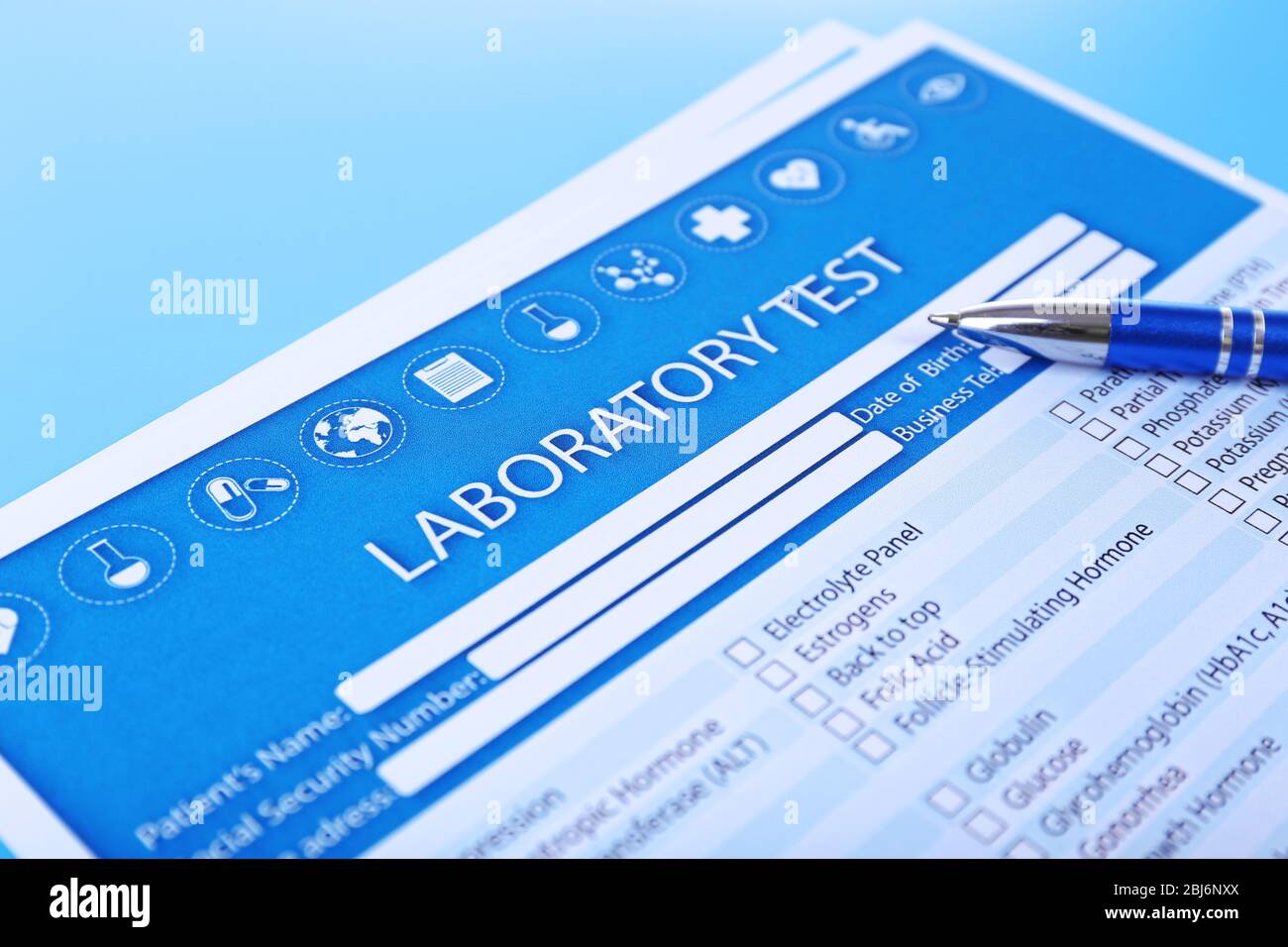 Laboratory test list with pen on blue background, close up Stock Photo ...