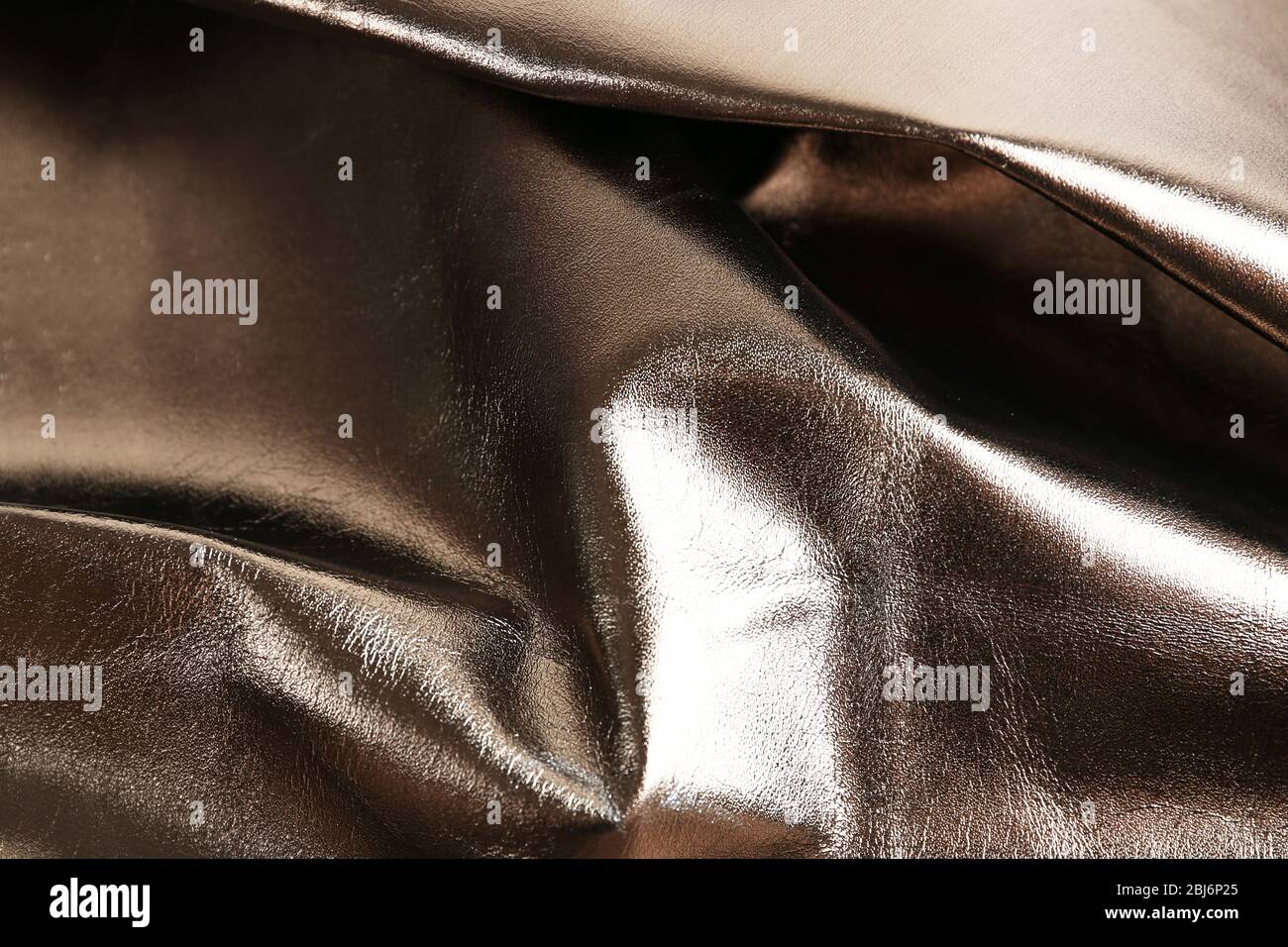 Dark brown shiny leather texture close up Stock Photo - Alamy