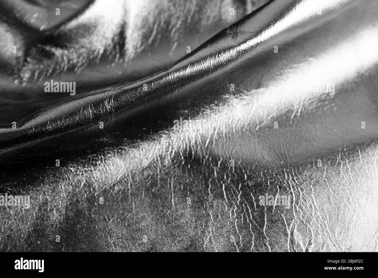 Dark brown shiny leather texture close up Stock Photo - Alamy