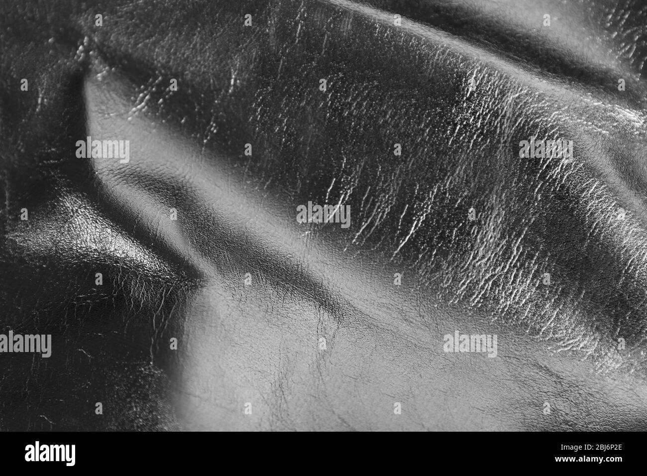 Dark brown shiny leather texture close up Stock Photo - Alamy