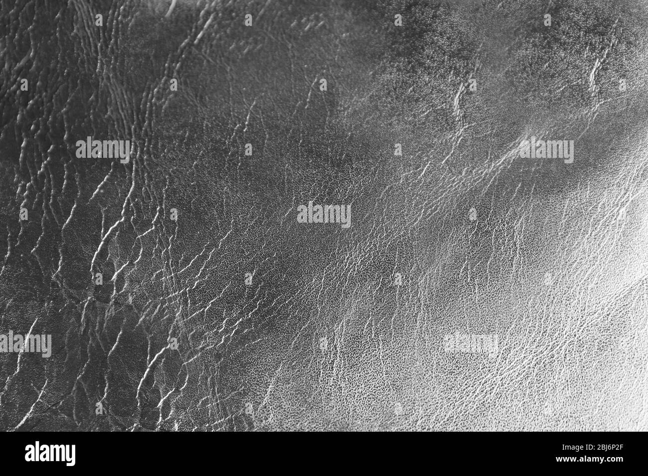 Dark brown shiny leather texture close up Stock Photo - Alamy