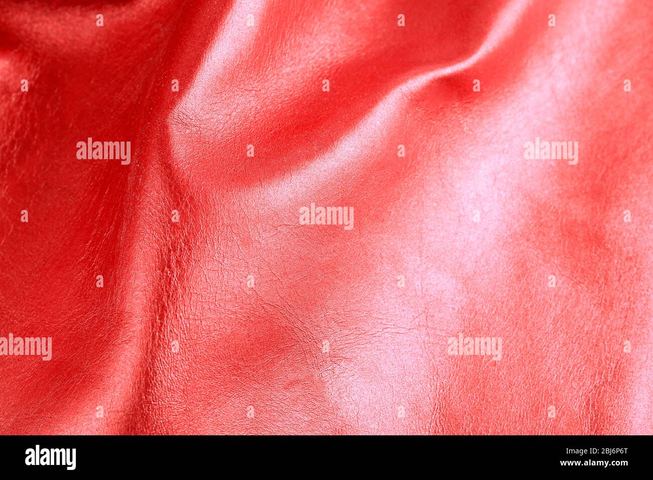 Red shiny leather texture close up Stock Photo - Alamy