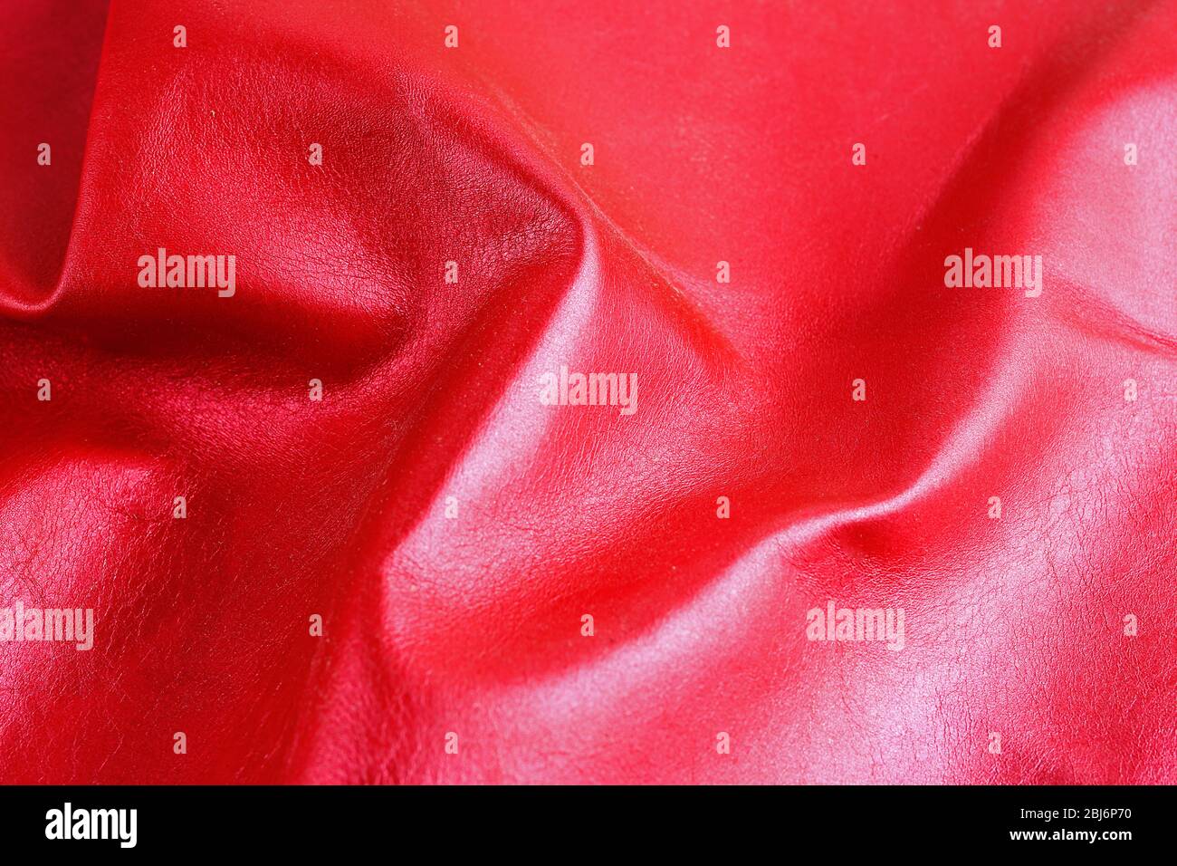 Red shiny leather texture close up Stock Photo - Alamy