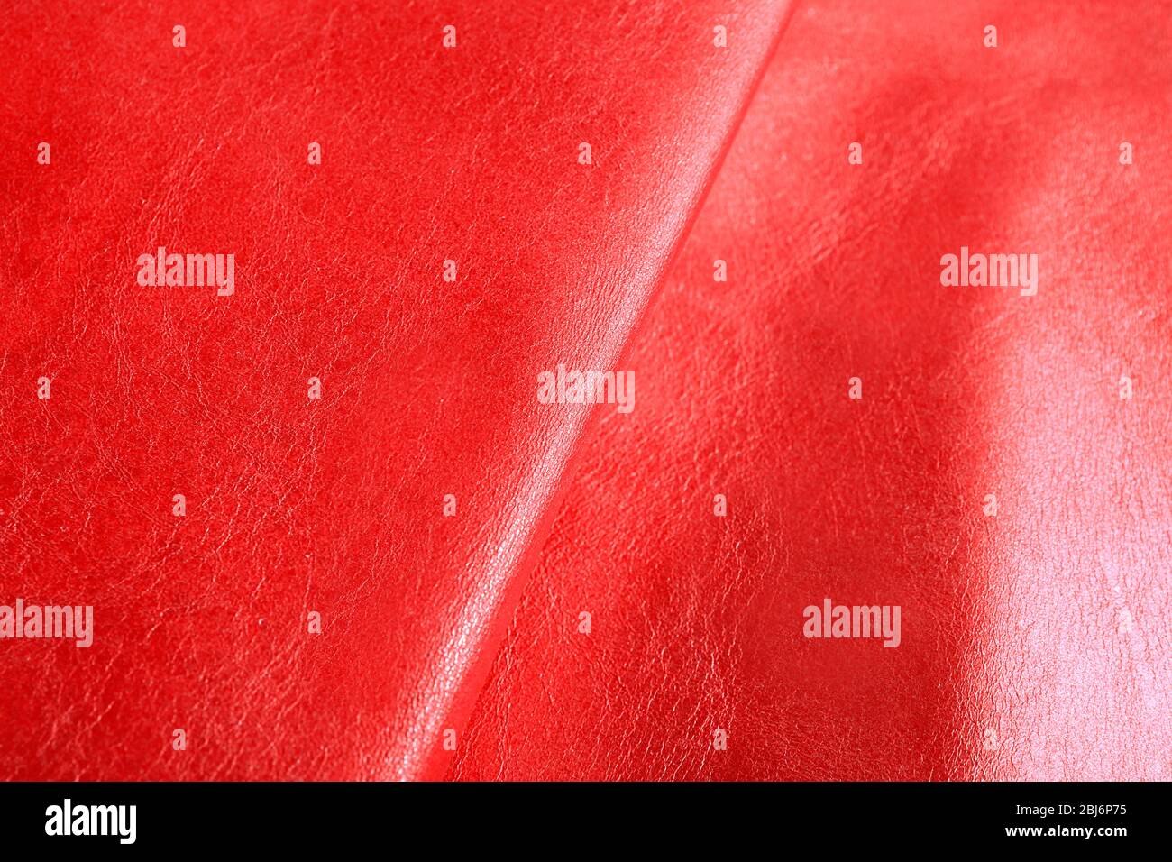 Red shiny leather texture close up Stock Photo - Alamy
