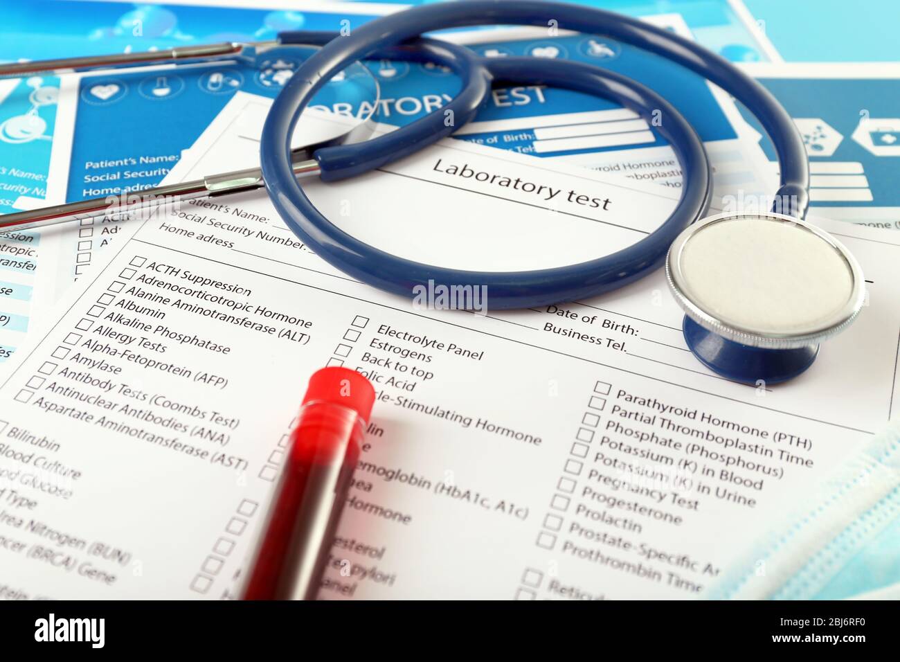Blood in test tubes, stethoscope and investigation form on the table ...