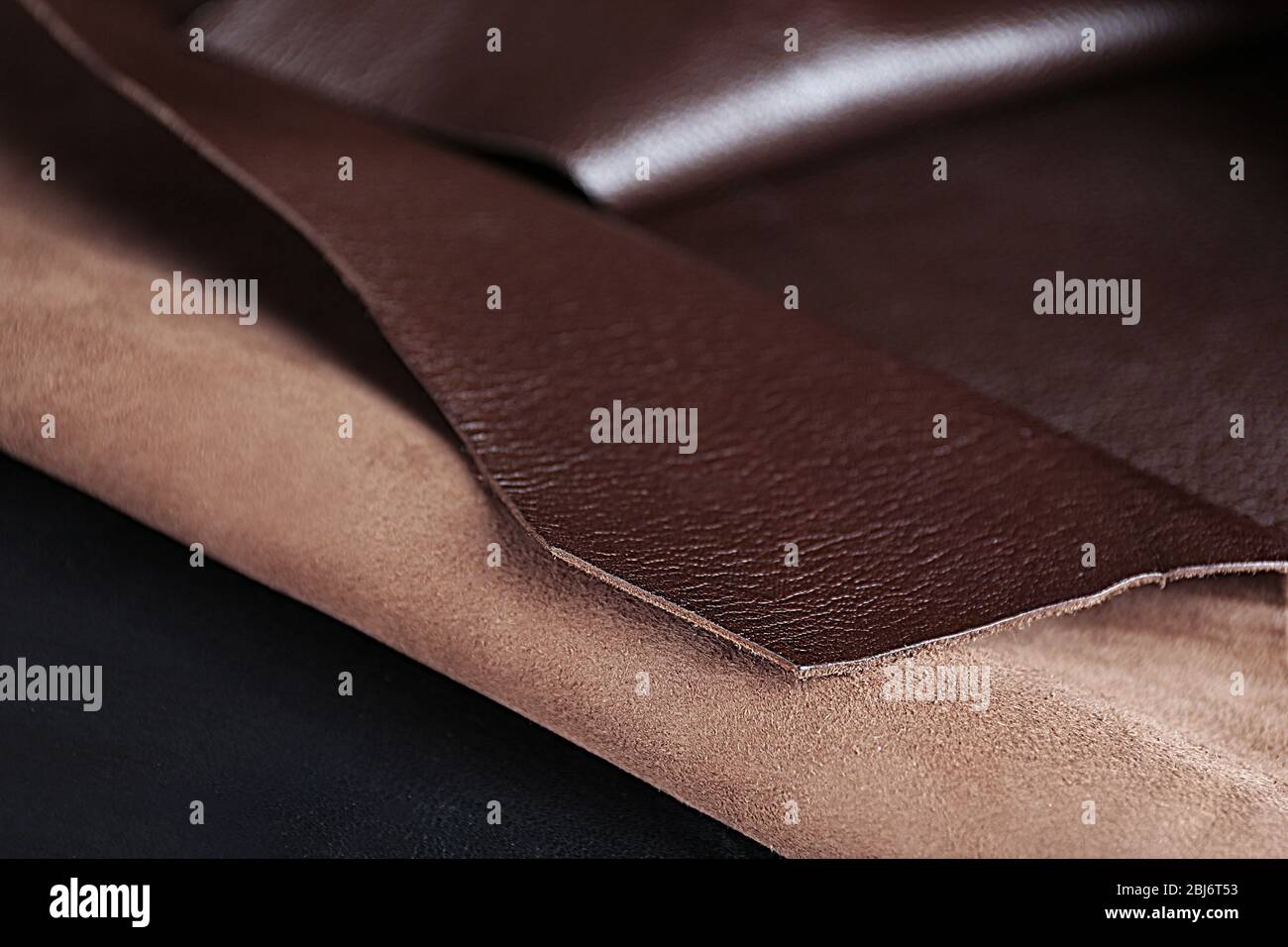 Folded brown leather material background Stock Photo - Alamy