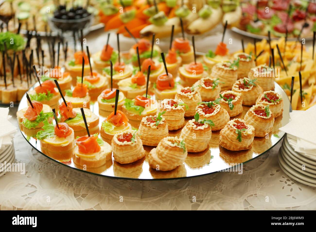 Dish with assorted snacks on a table Stock Photo - Alamy