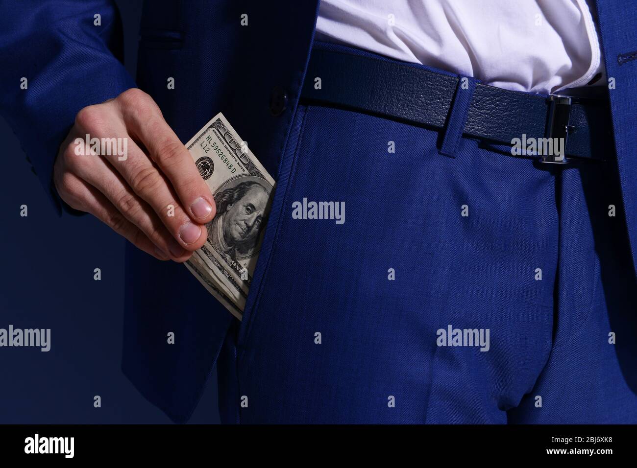 Businessman pocket full banknotes hi-res stock photography and images ...