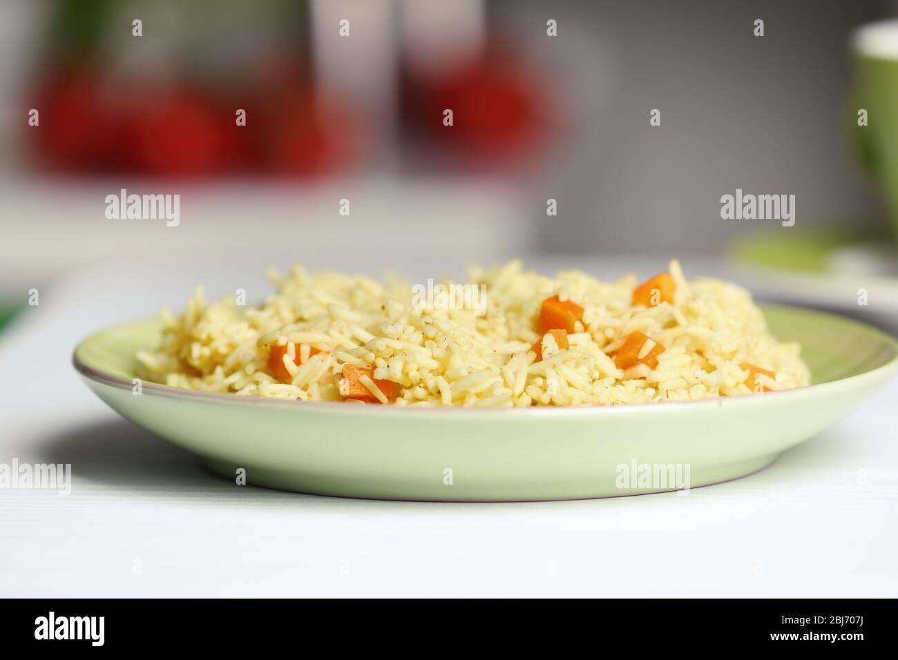 Stewed rice with a carrot on a , close up Stock Photo - Alamy