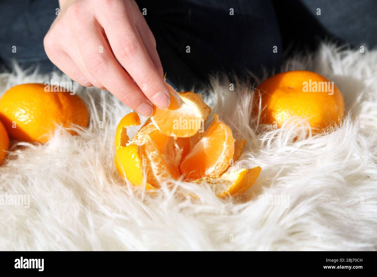 Woman peeling tangerine fresh fruit hi-res stock photography and images ...