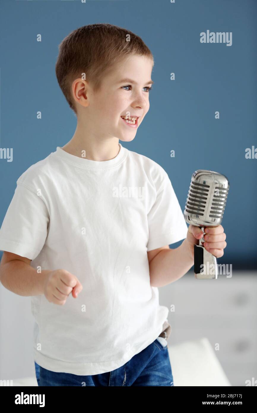 Little boy with microphone at home Stock Photo - Alamy