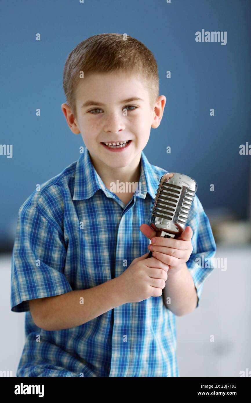 Little boy with microphone at home Stock Photo - Alamy