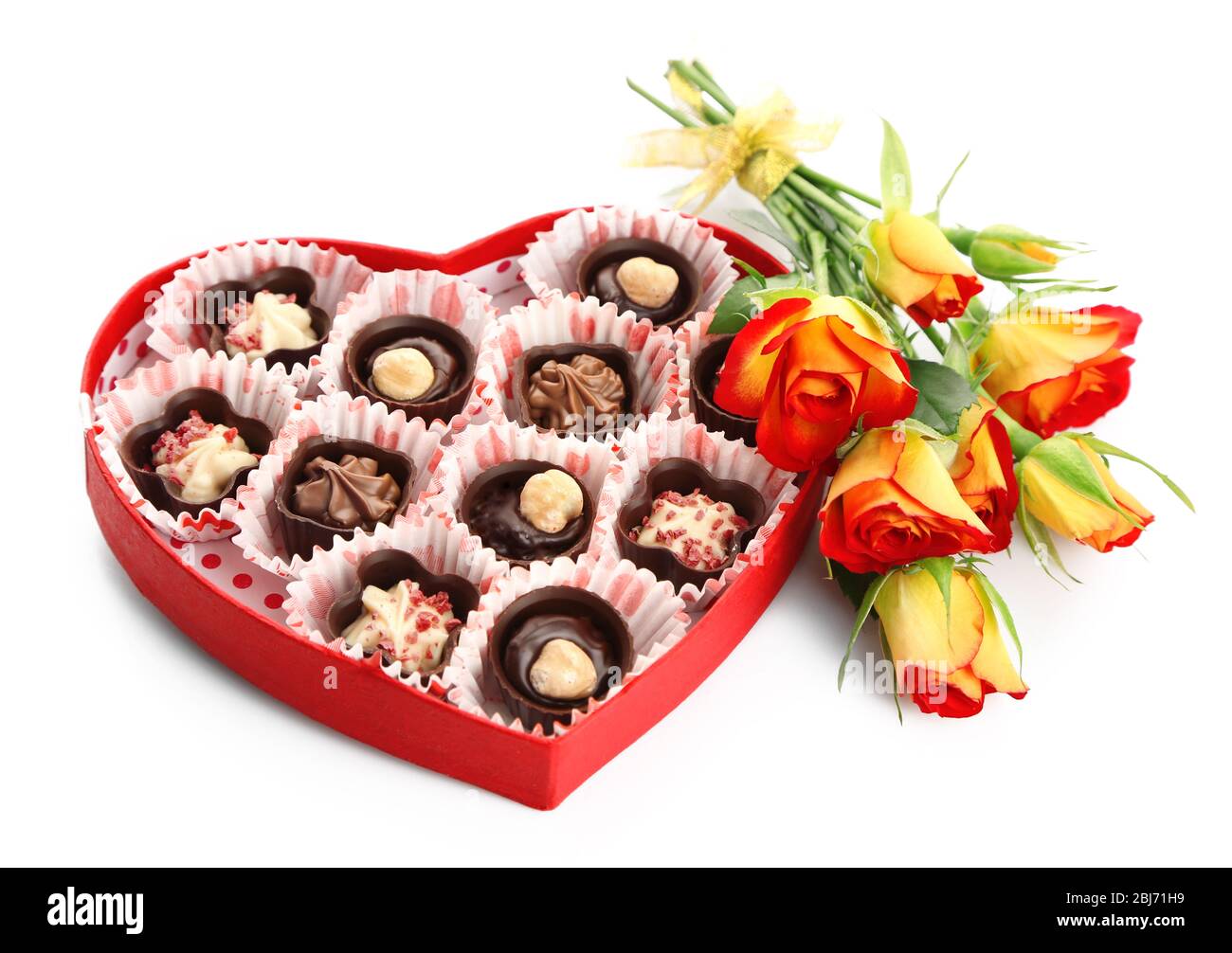 Heart shaped box with candies and flowers, isolated on white Stock ...
