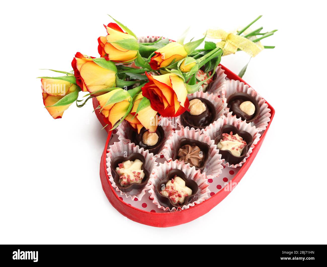 Heart shaped box with candies and flowers, isolated on white Stock ...