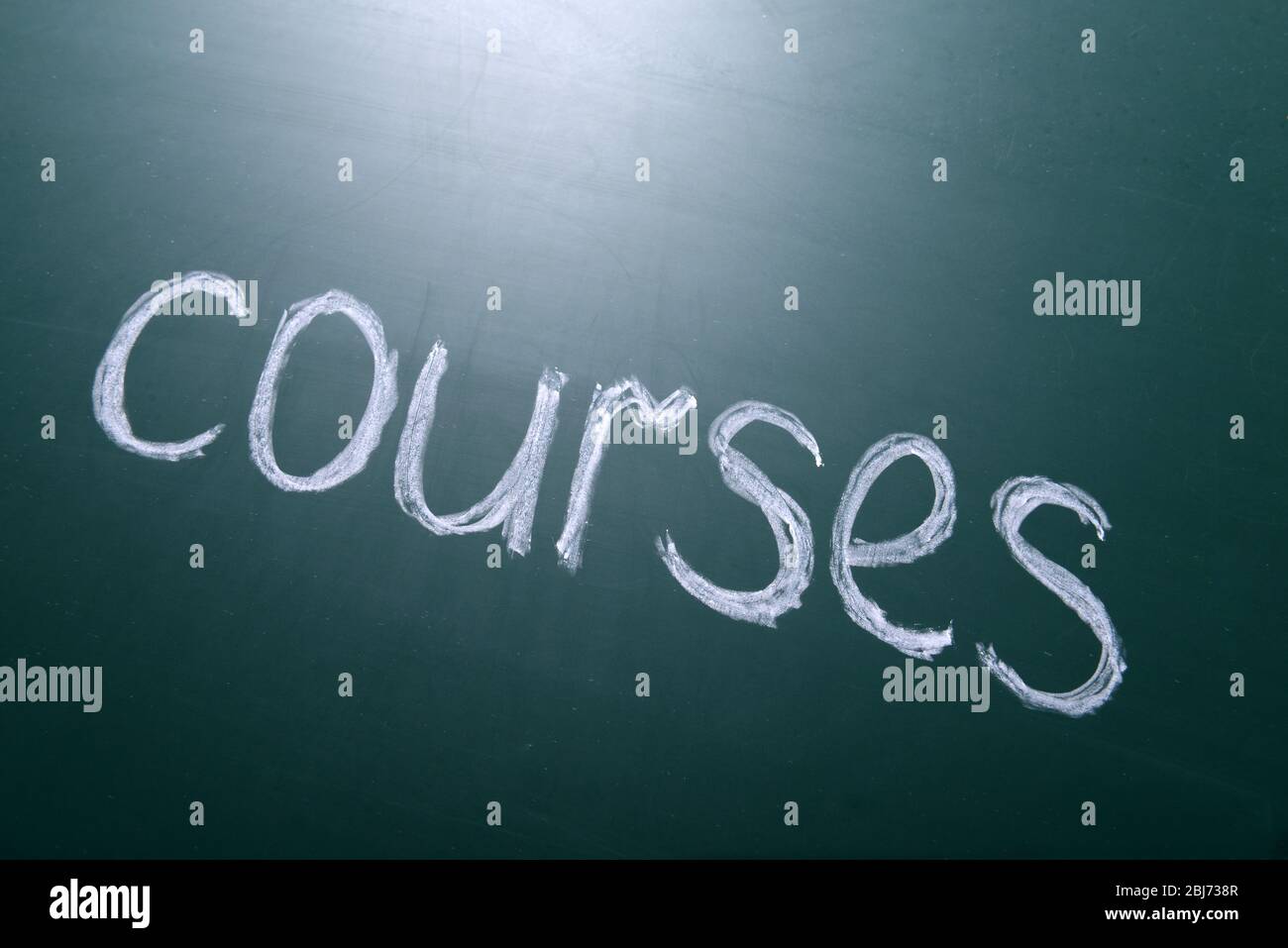 Courses inscription written with white chalk on blackboard Stock Photo ...