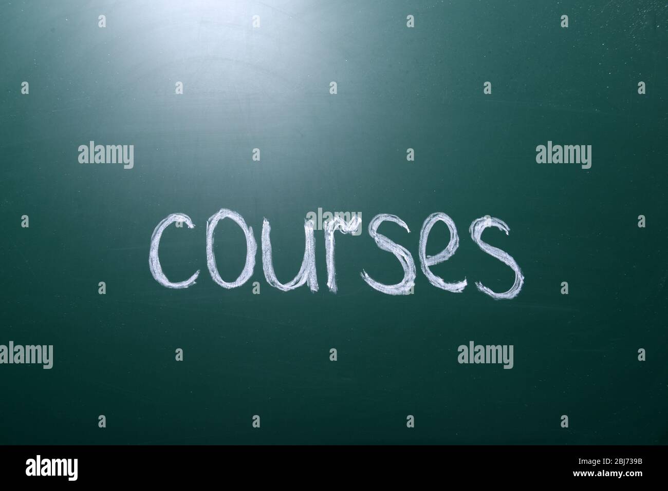 Courses inscription written with white chalk on blackboard Stock Photo ...