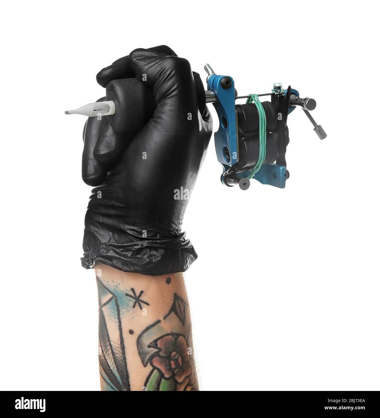 Man's hand holding tattoo machine on white background Stock Photo - Alamy
