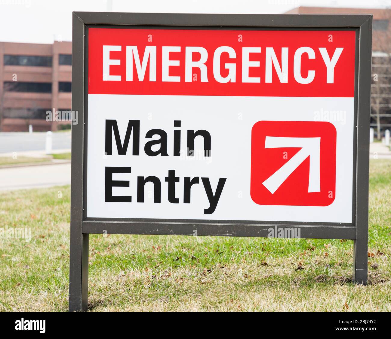 Emergency main entry sign directing visitors toward healthcare facility ...