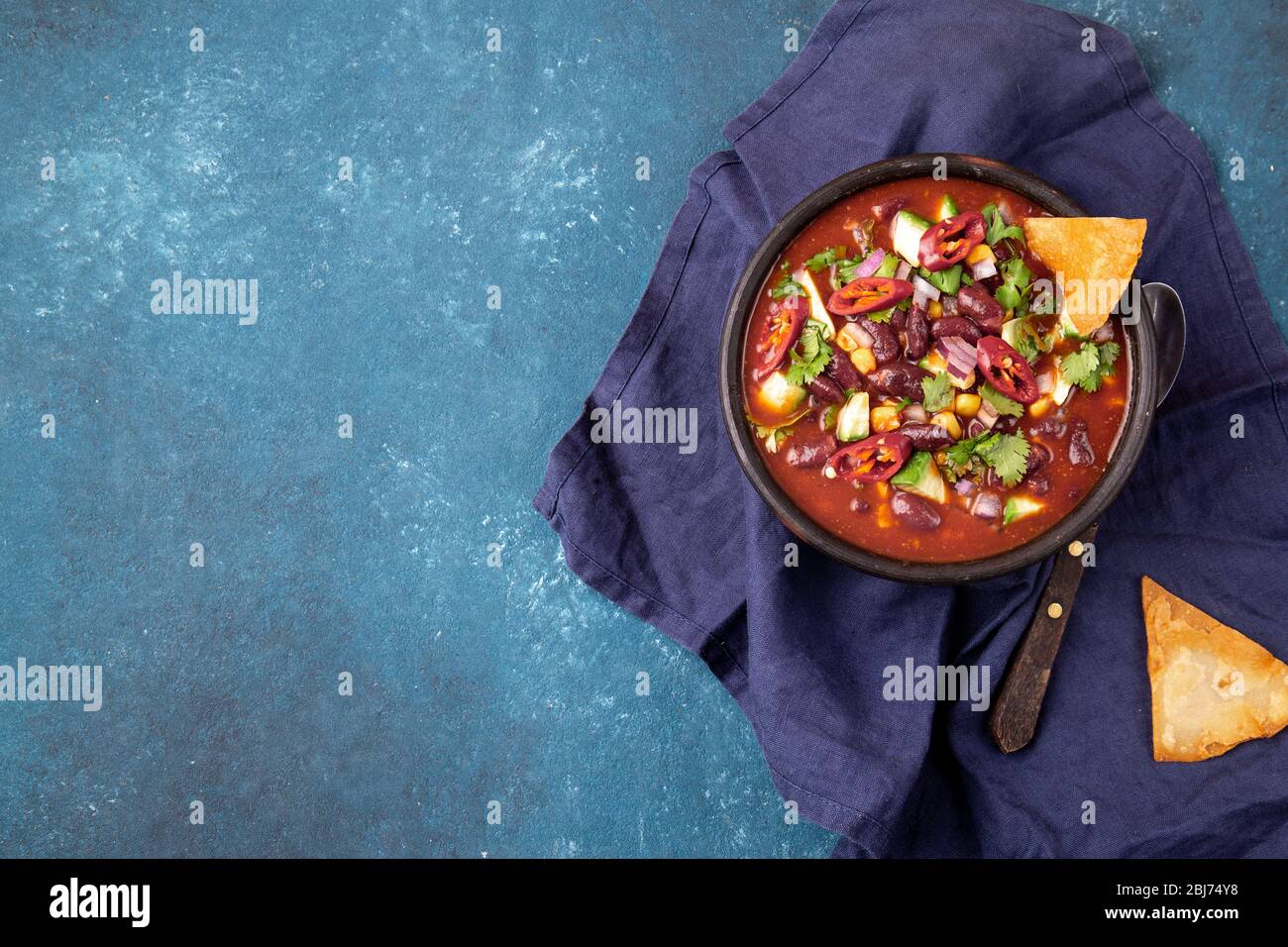 Mexican chile bean soup on blue background Stock Photo - Alamy