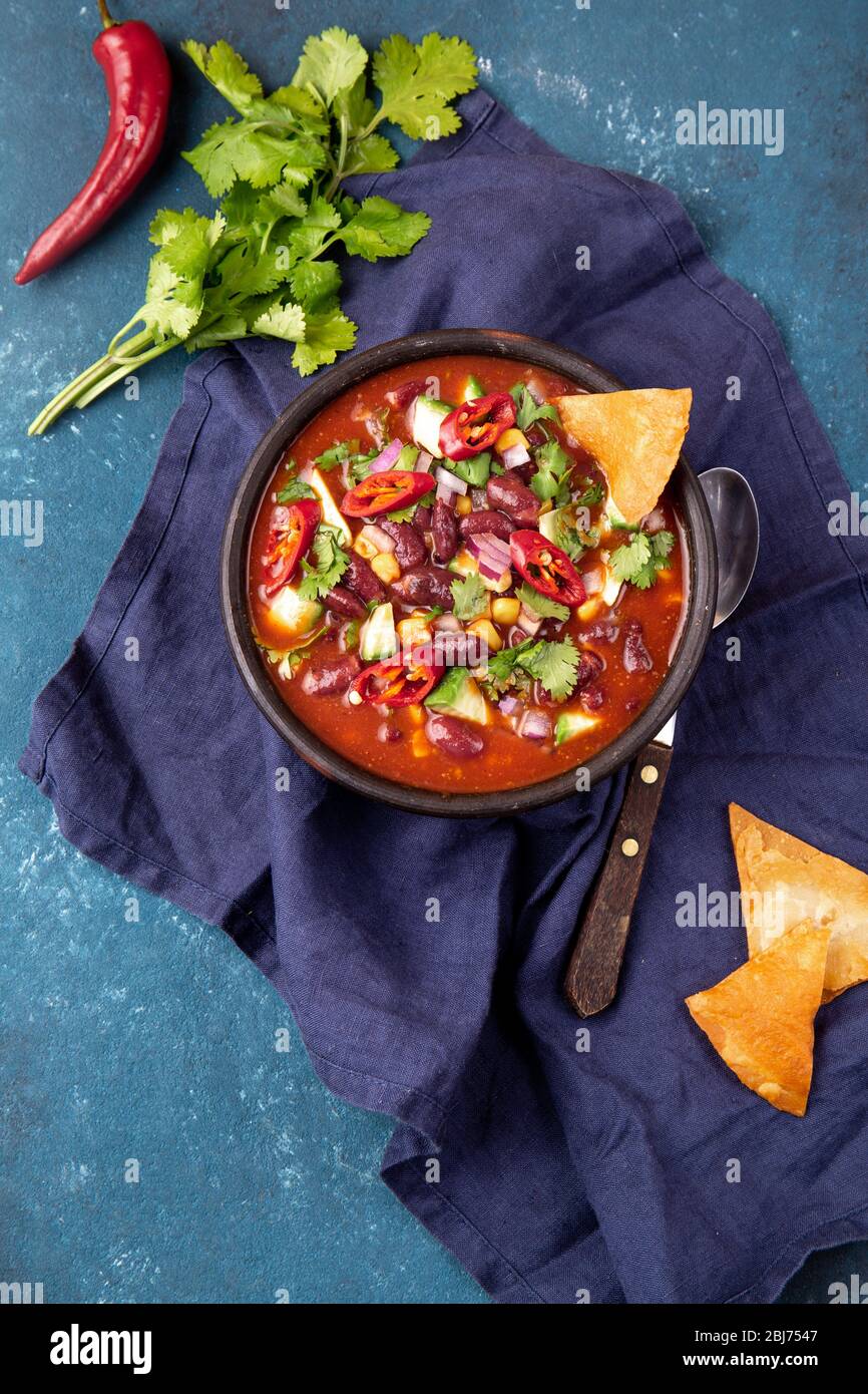 Mexican chile bean soup on blue background Stock Photo - Alamy