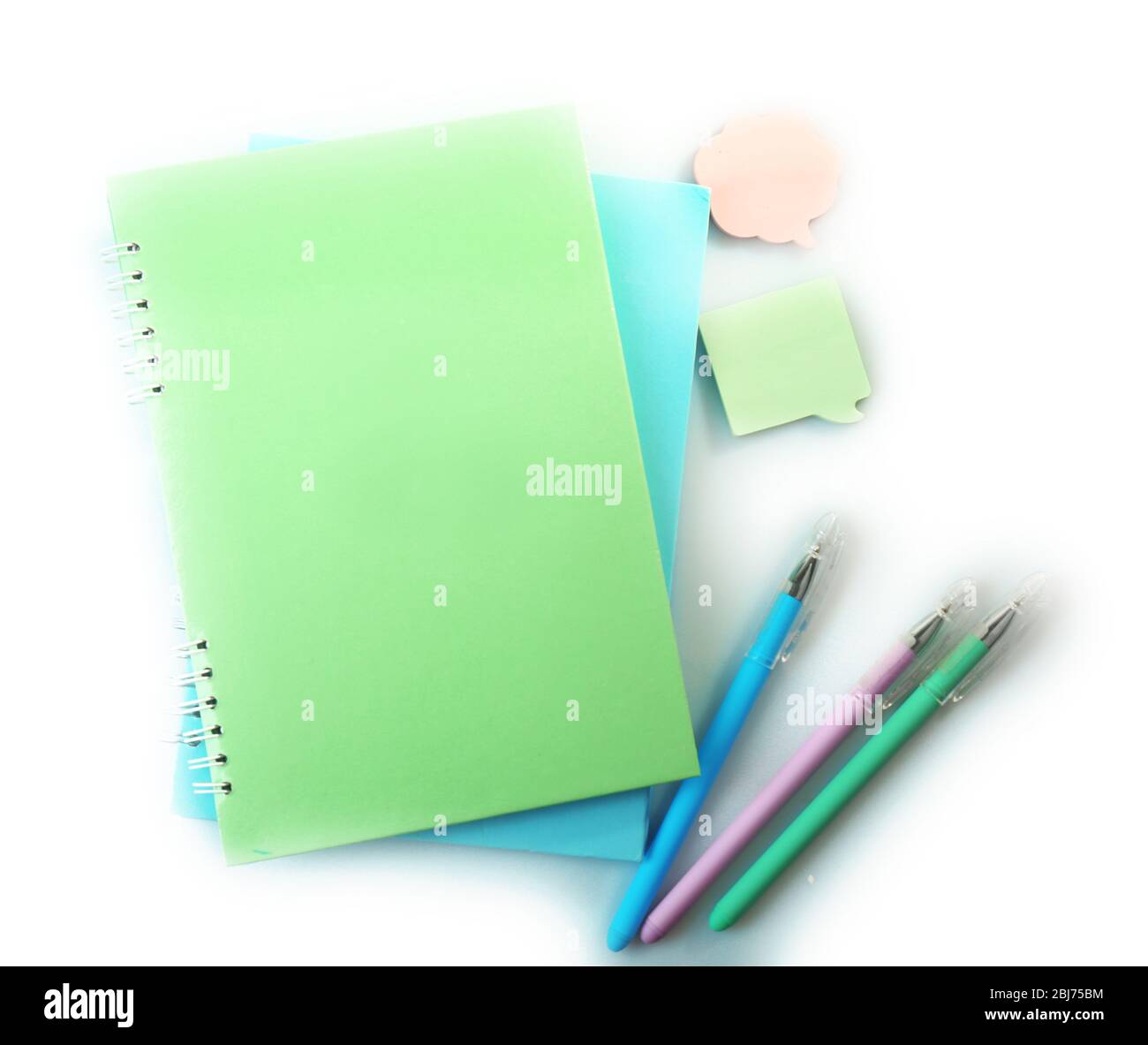 A pile of notebooks and stationary, isolated on white background Stock ...