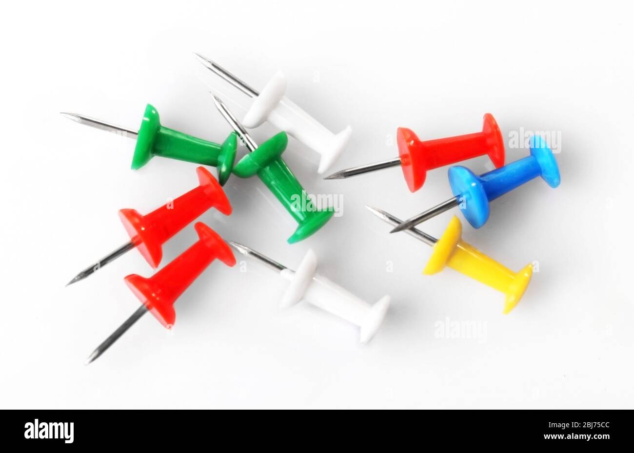 Group of push-pins, isolated on white Stock Photo - Alamy