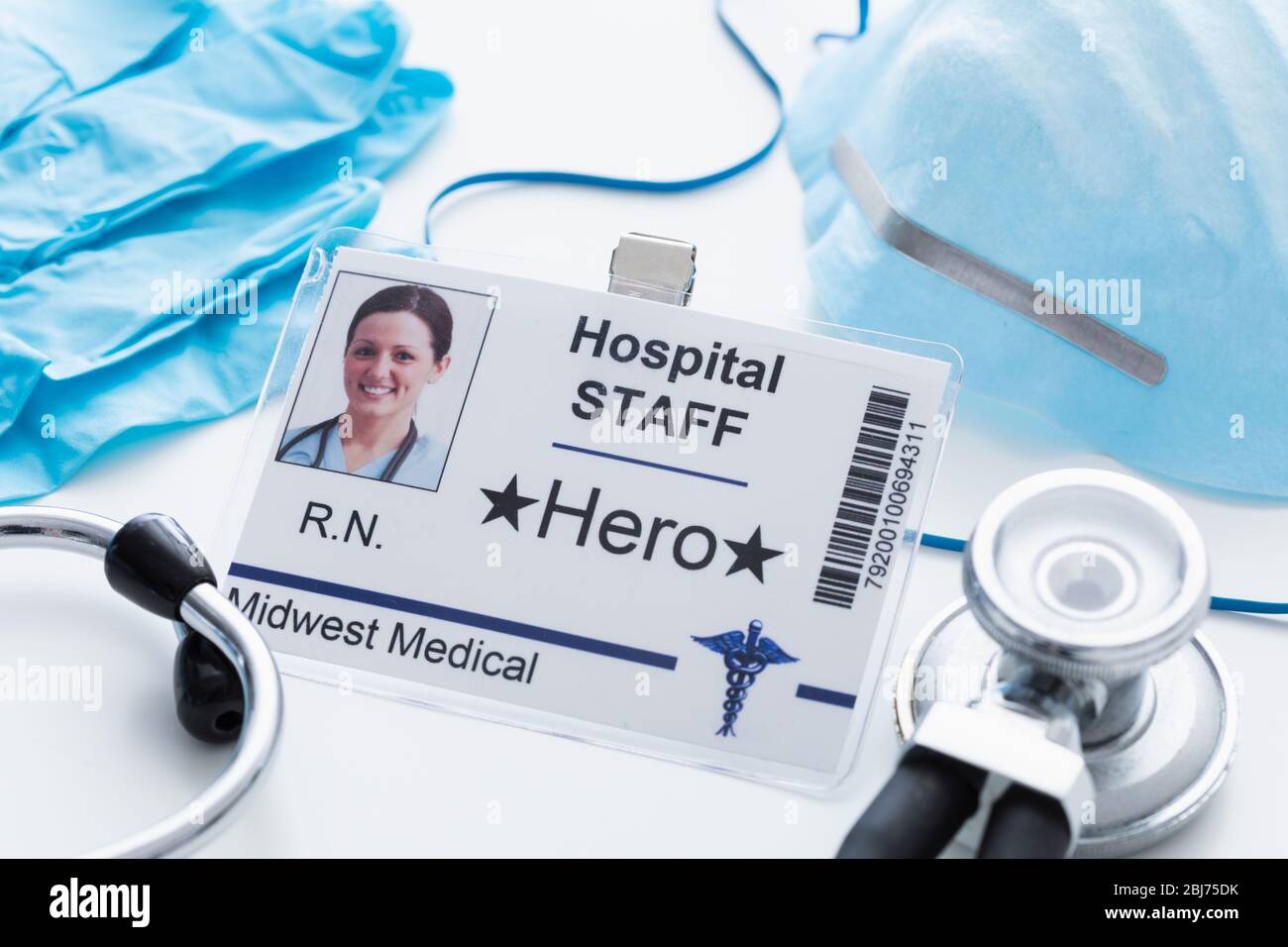 Hospital staff identification badge with medical tools displayed on a ...