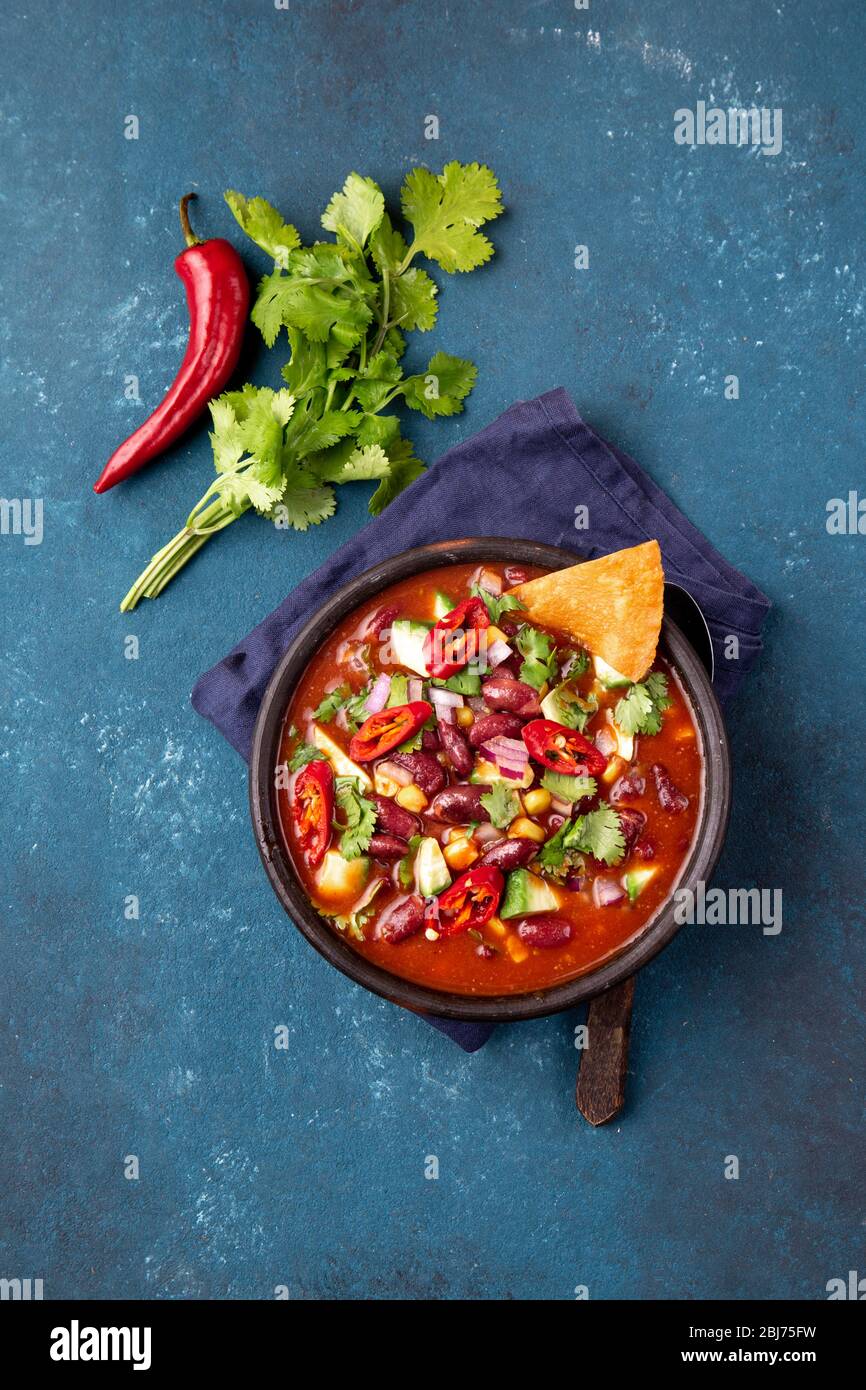 Mexican chile bean soup on blue background Stock Photo - Alamy