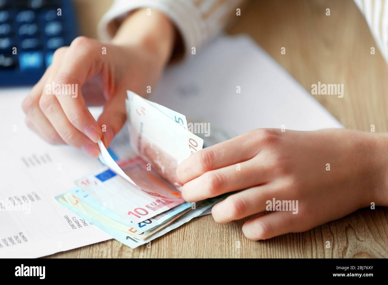 Woman money calculate euro hi-res stock photography and images - Alamy