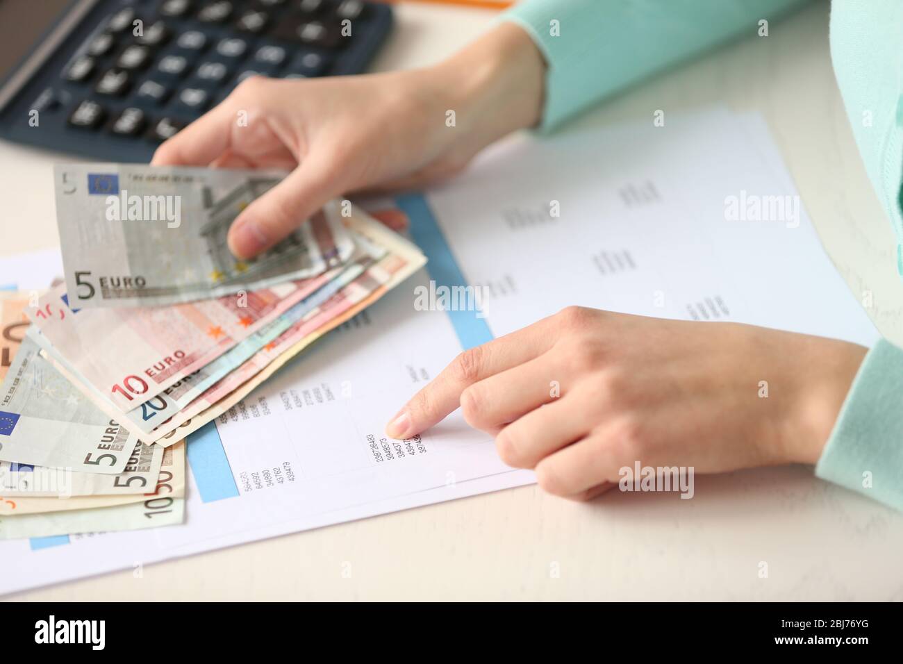 Woman money calculate euro hi-res stock photography and images - Alamy