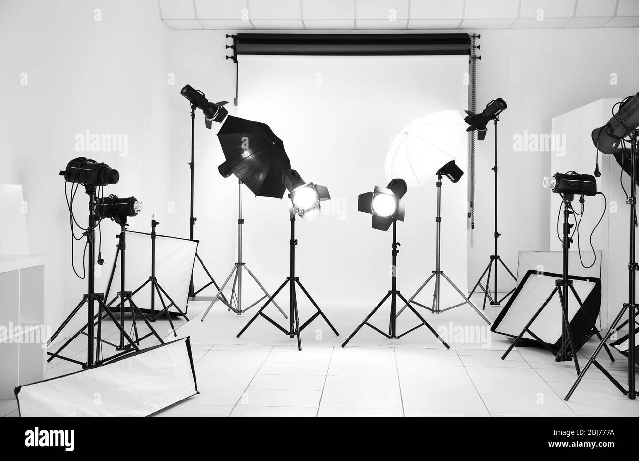 Empty photo studio with lighting equipment Stock Photo - Alamy