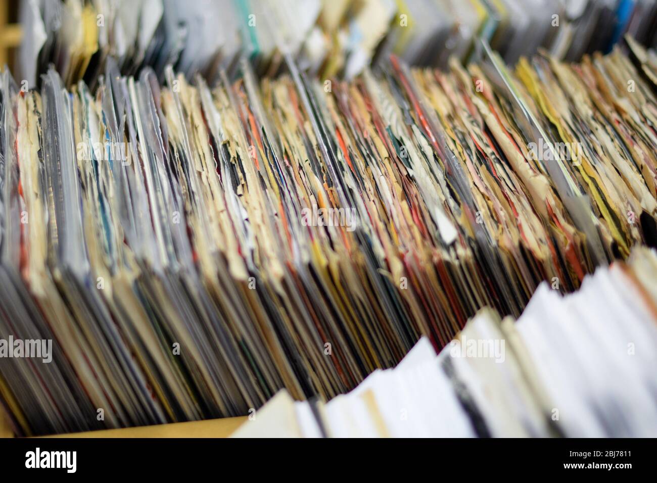 Old vinyl records stacked in crate Stock Photo - Alamy