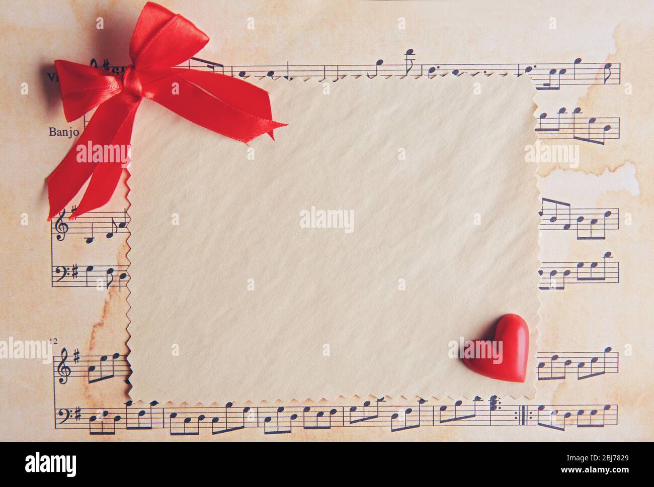 Blank present Valentine card on music sheet background Stock Photo - Alamy