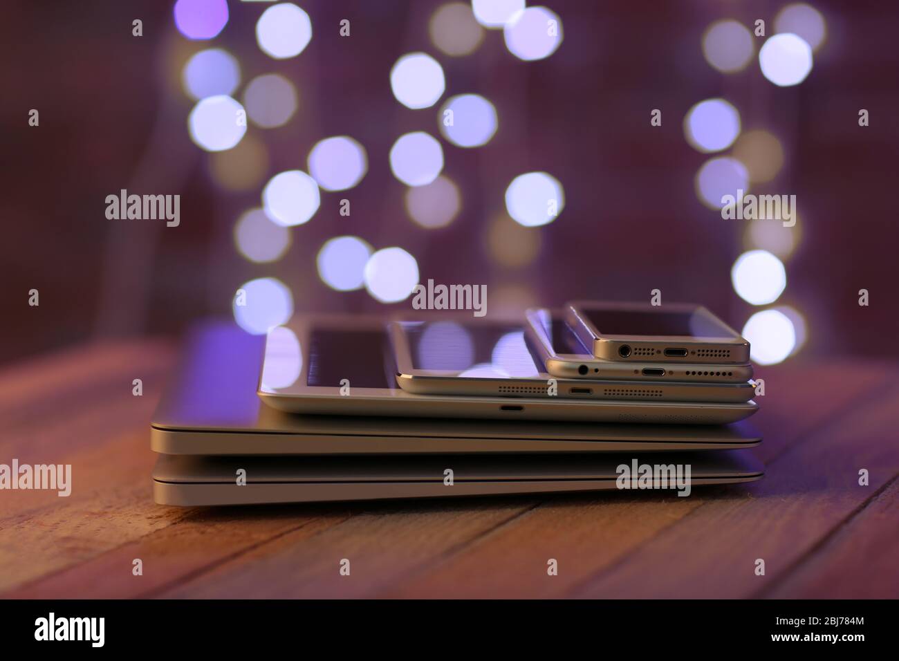 Pile of electronic gadgets on the table. Communication and technology ...