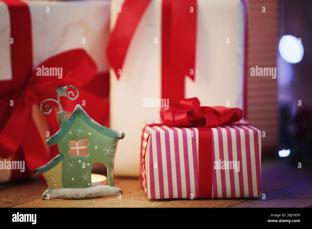 Christmas gift boxes on the wooden table, close-up Stock Photo - Alamy