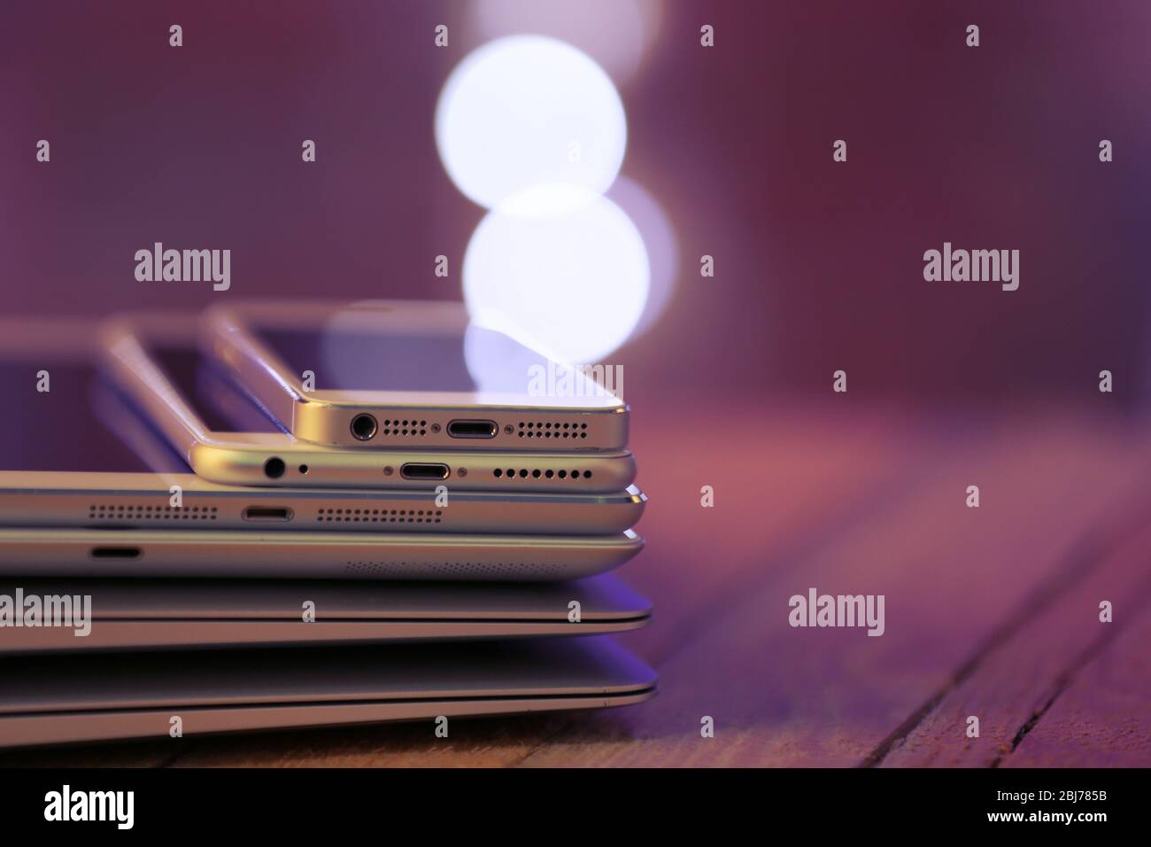 Pile of electronic gadgets on the table. Communication and technology ...