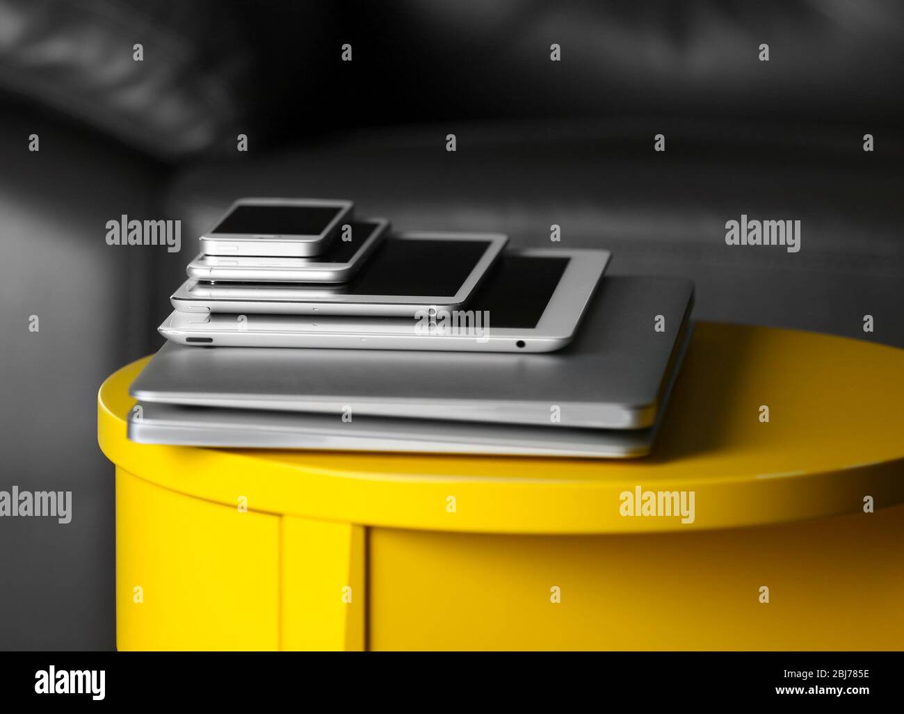 Pile of electronic gadgets on the table. Communication and technology ...