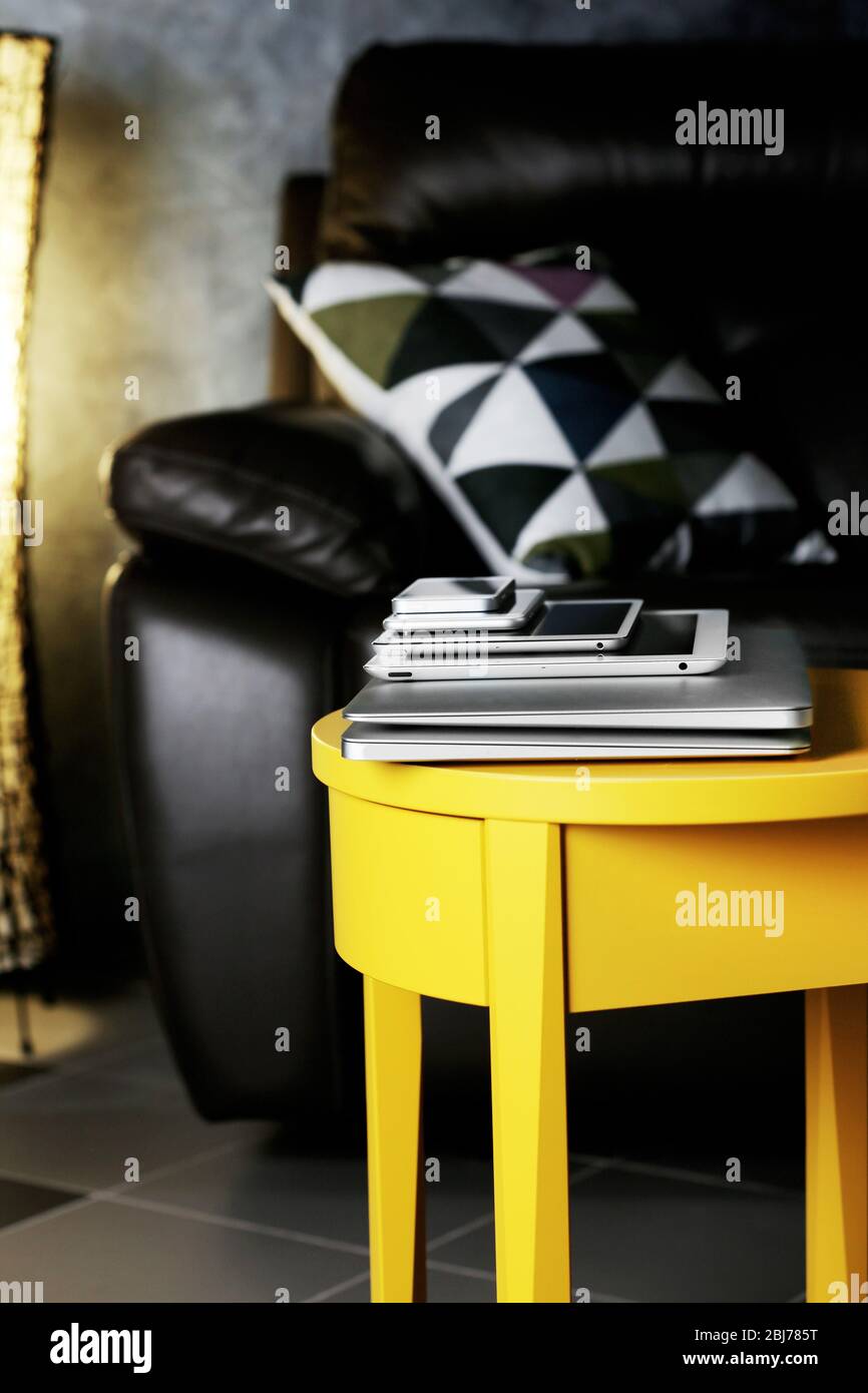 Pile of electronic gadgets on the table. Communication and technology ...