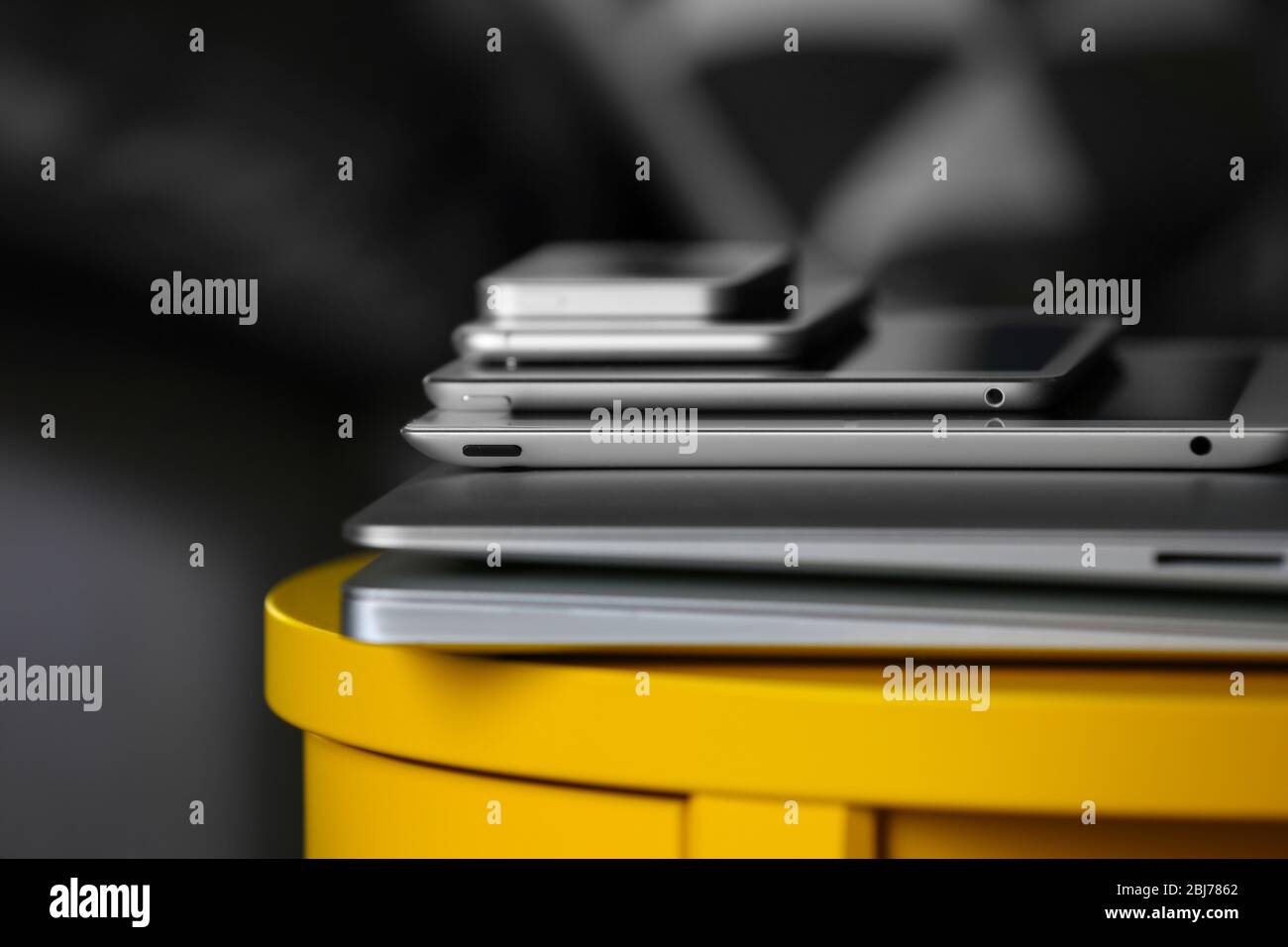 Pile of electronic gadgets on the table. Communication and technology ...