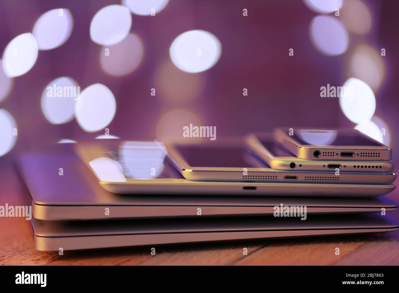 Pile of electronic gadgets on the table. Communication and technology ...