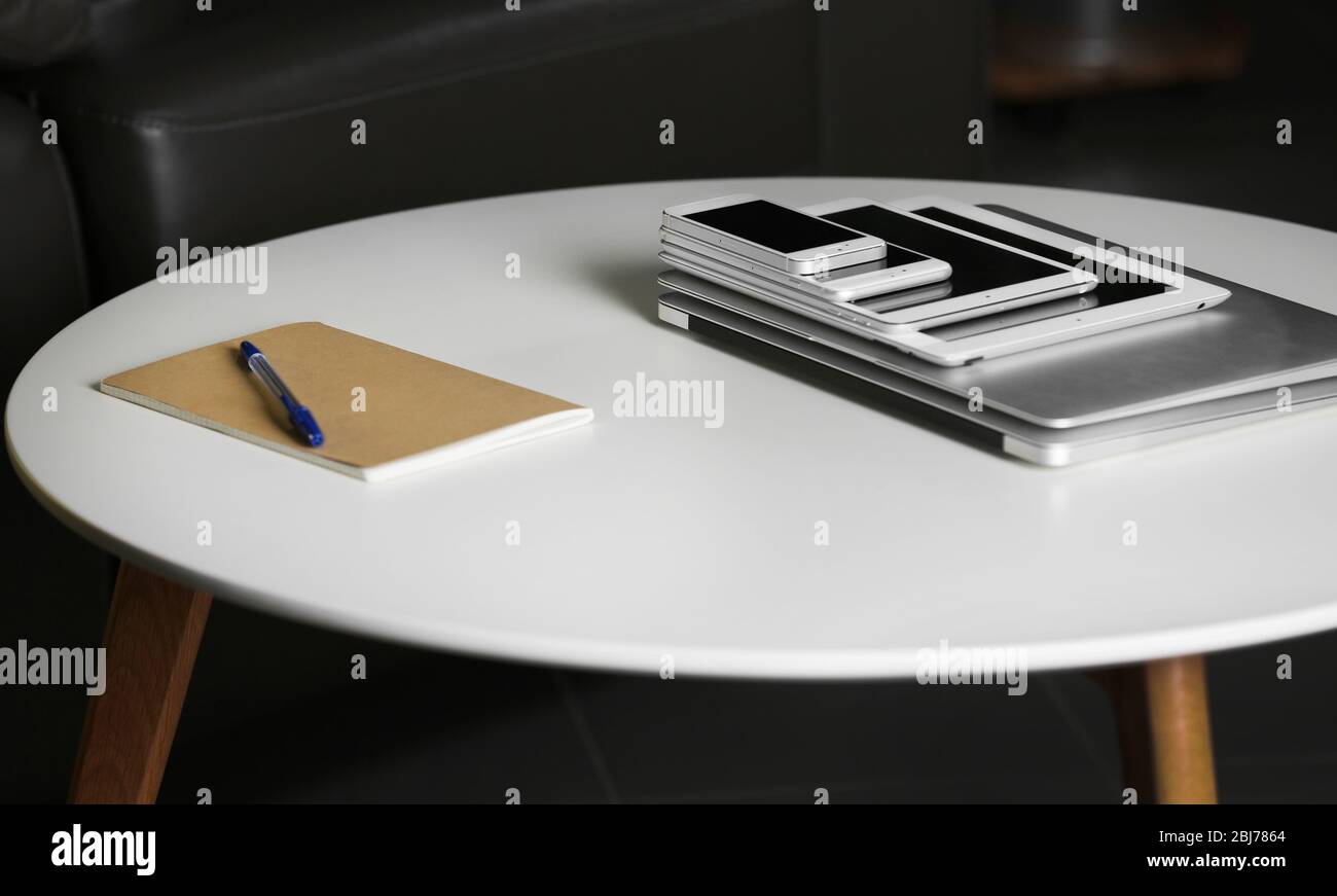 Pile of electronic gadgets on the table. Communication and technology ...