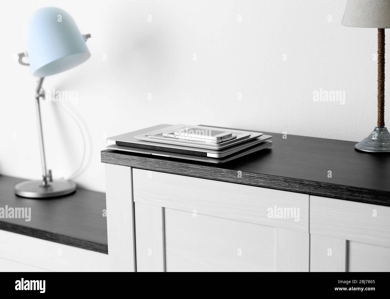 Pile of electronic gadgets on the table. Communication and technology ...