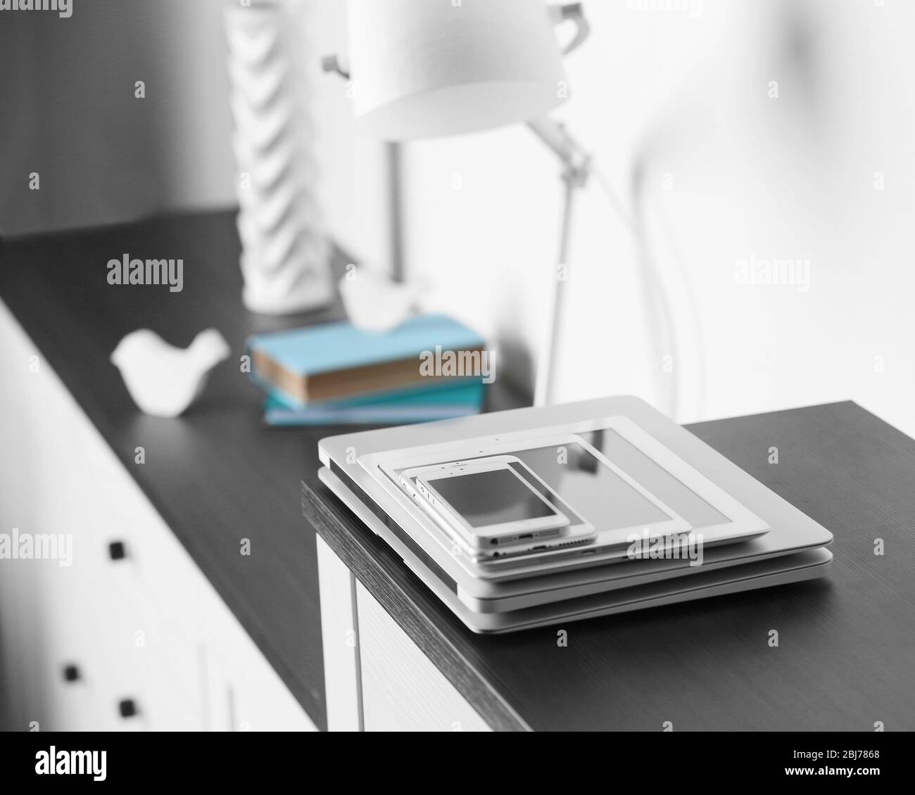 Pile of electronic gadgets on the table. Communication and technology ...